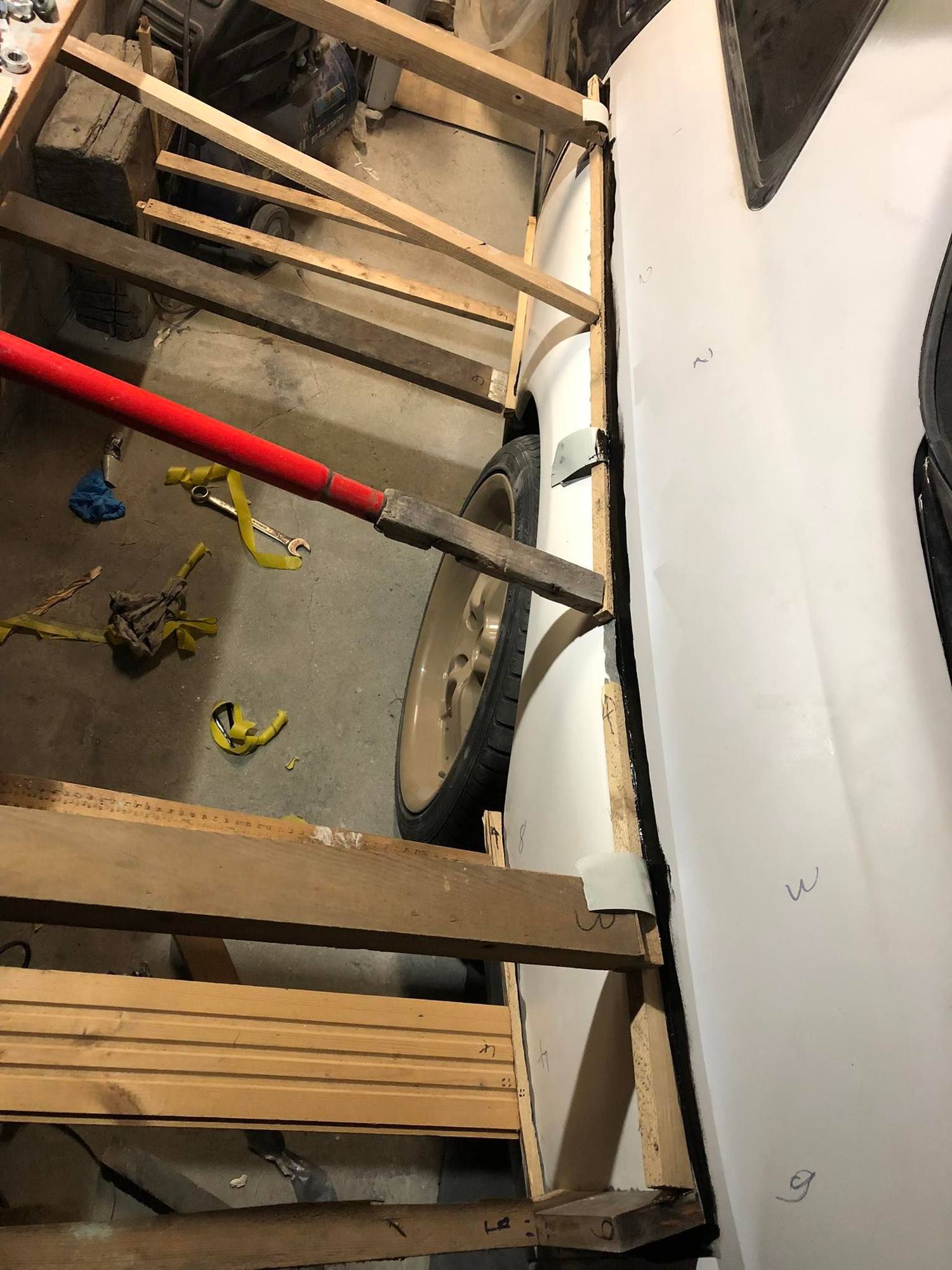 Looking for advice on bonding fiberglass overfenders to a steel chassis ...