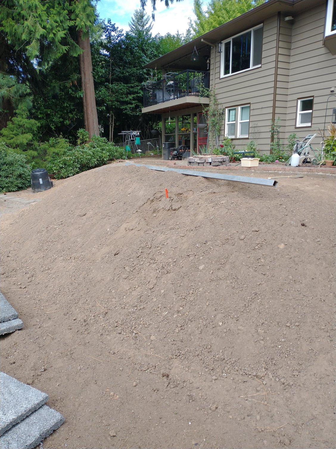 How to properly compact deep soil put onto a slope for a future patio ...