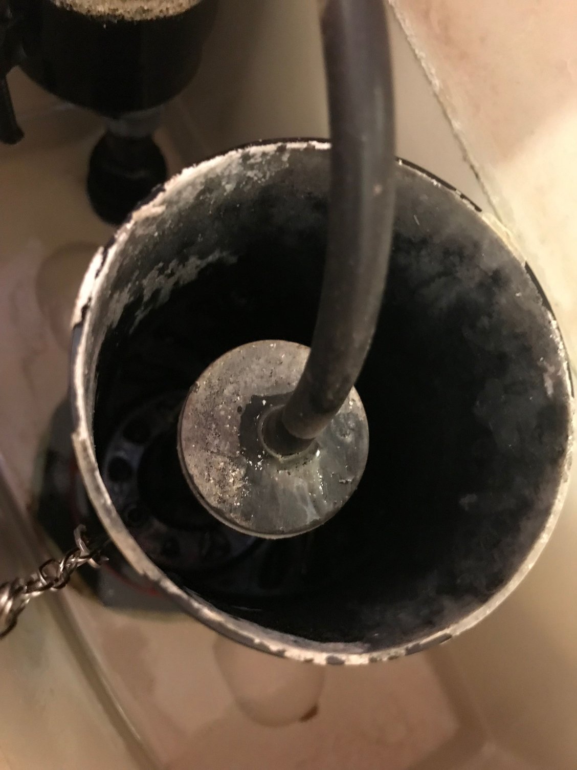 The flush valve (or fill valve) won't drop back after the tank is full ...