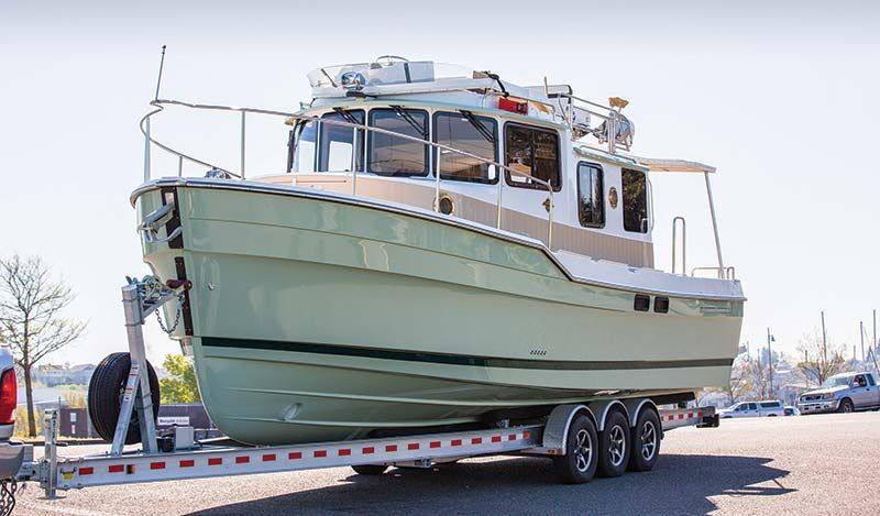 The Hull Truth - Boating and Fishing Forum - Ranger Tug 31CB on a trailer.